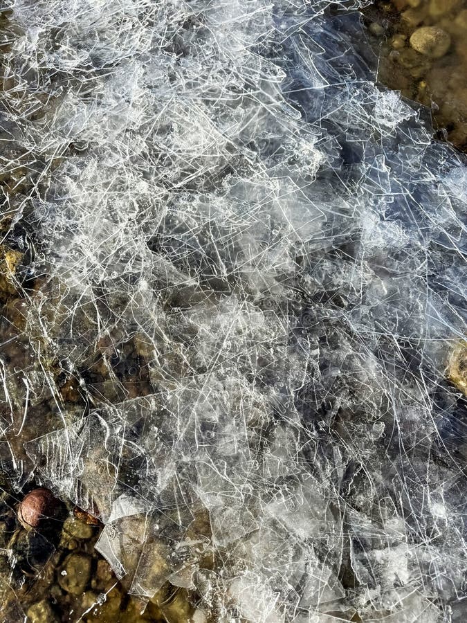 Cracked Ice on the Rocky Shore of the Lake Stock Image - Image of ...