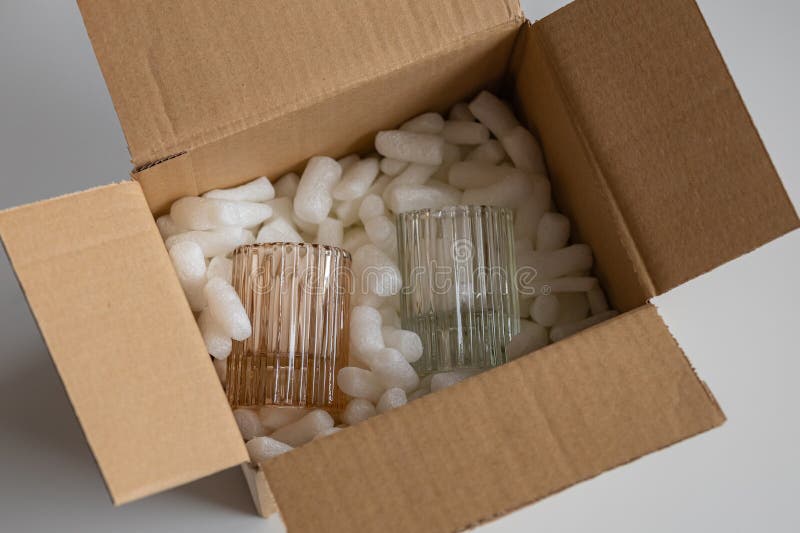 Fragile Glassware in Pastel Shades Carefully Packed with Protective ...