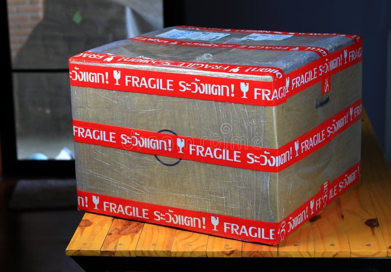 Fragile Marked Parcel, Cardboard Boxes with Fragile Symbol on Wooden ...