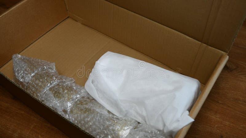 Fragile Tableware Items Wrapped into Plastic Bubble Wrapping Inside ...