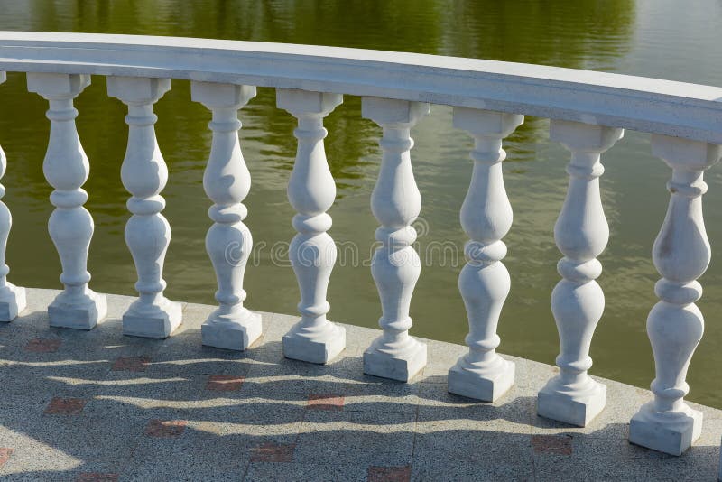 Fragment of Balustrade with Shaped Balusters Over Water Stock Photo ...