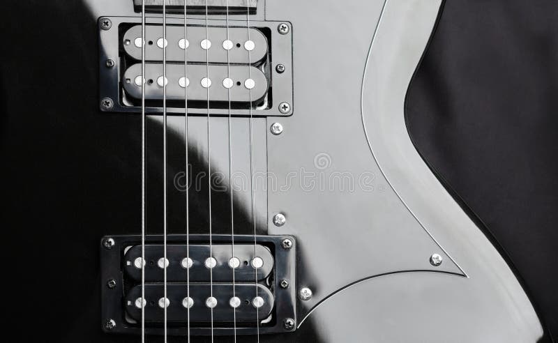 A Fragment of a Black Guitar with Steel Strings Stock Photo - Image of ...