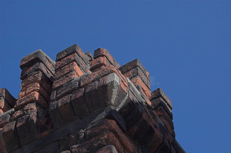 Fragment of a Brick Tower Building Against a Blue Cloudless Sky Stock ...