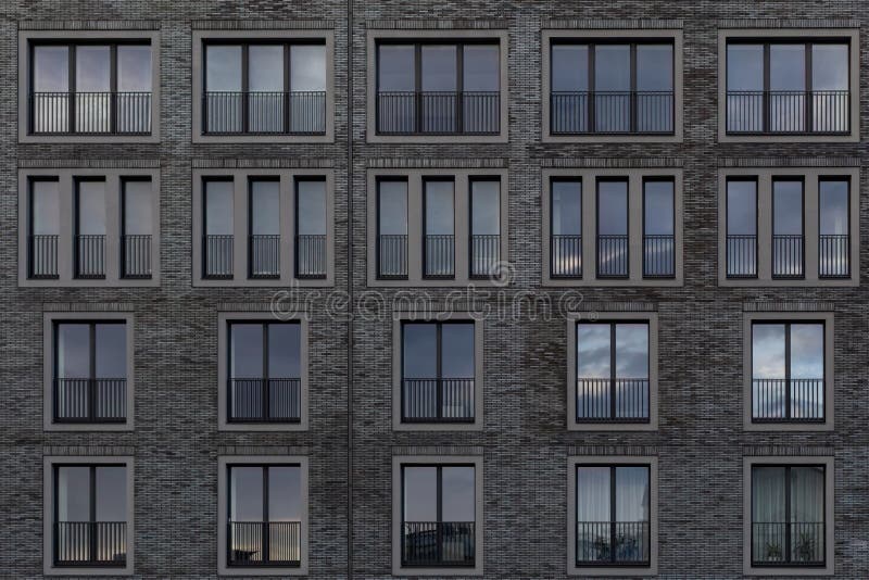 Fragment of Facade of Building with Windows. Facing with Black Brick ...