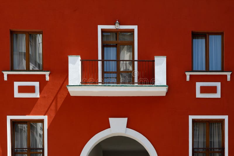 Fragment of the Facade of a Red Building with Windows, Balcony and ...
