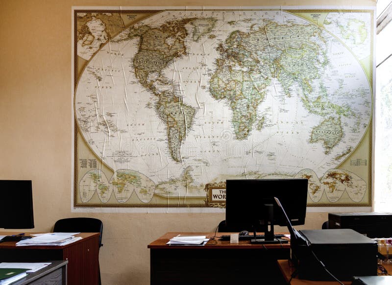A Fragment of an Office Room with a Large Map of the World Stock Photo ...