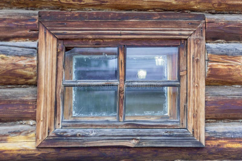A Fragment of an Old Wooden Hut with a Window. an Old Small Window with ...