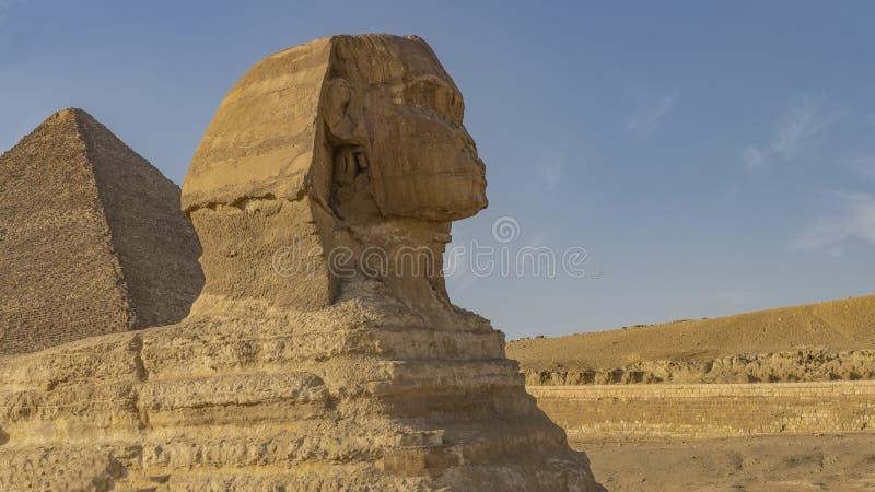 A Fragment of the Sculpture of the Great Sphinx Against the Blue Sky ...