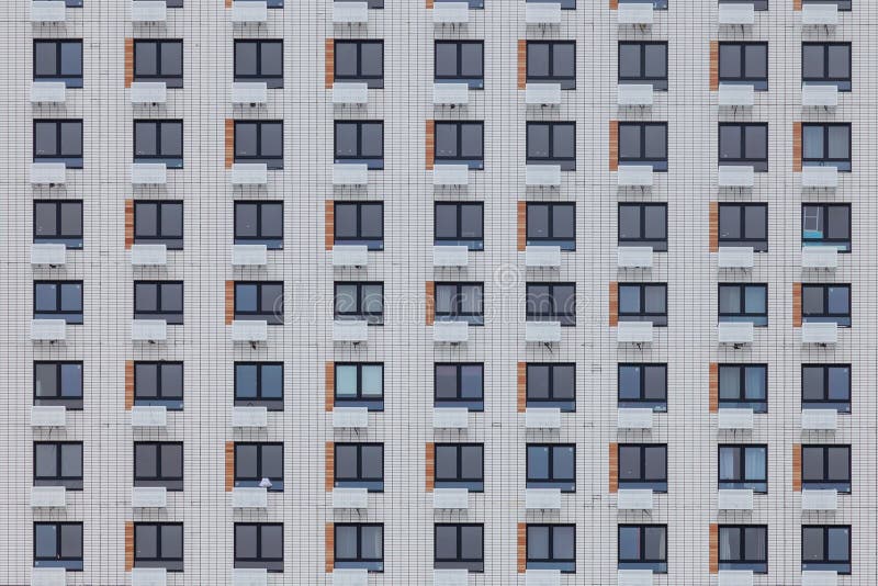 Fragment of the Wall of a Multi-storey White Building with Windows ...