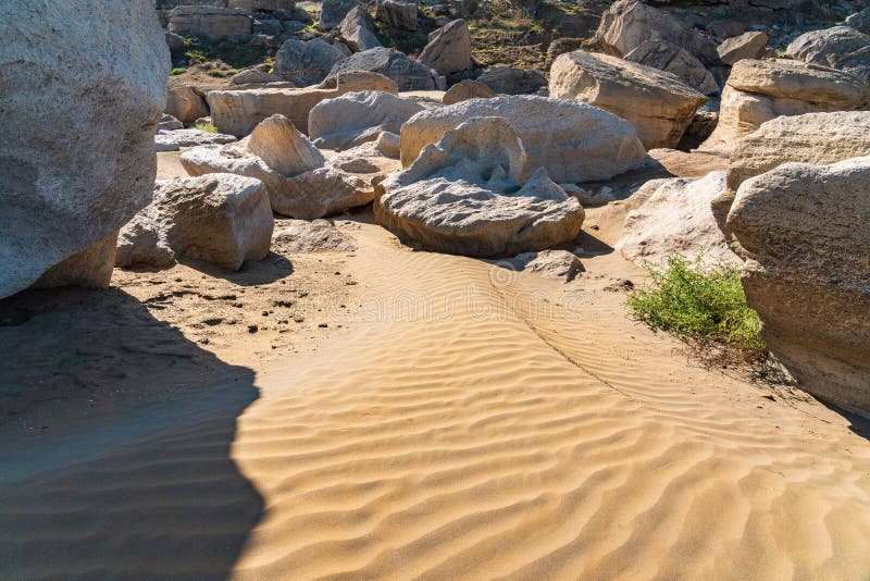 Fragments of Ancient Rocks on the Sandy Coast Stock Image - Image of ...