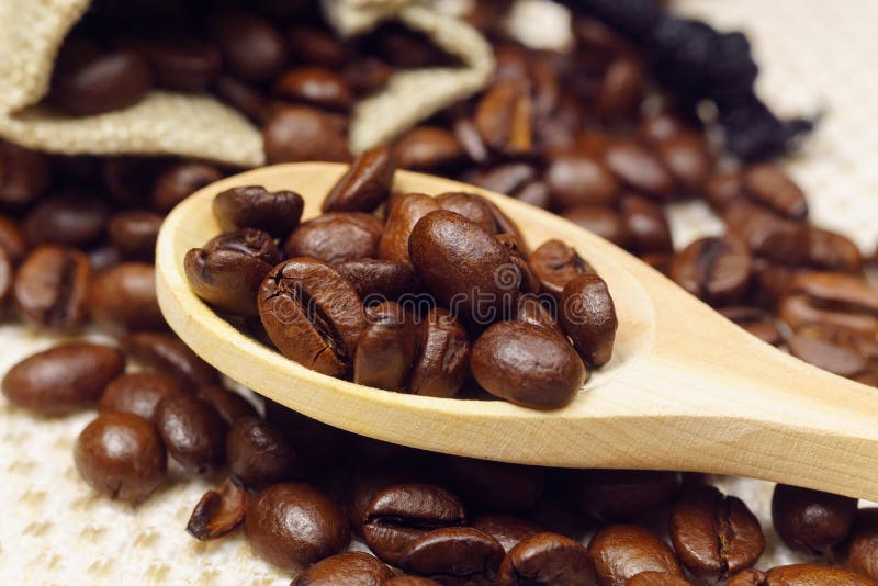Fragrant Coffee Beans Fall Close-up. a Wooden Spoon Coffee Beans Stock ...