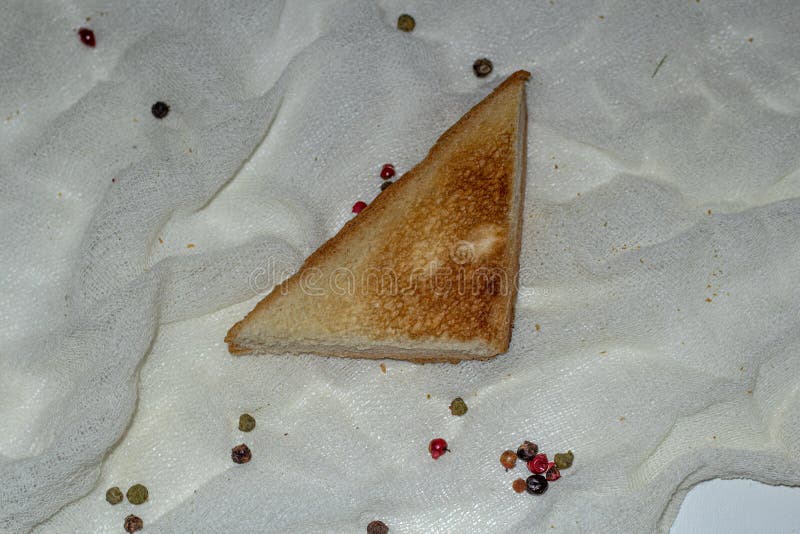 Fragrant Freshly Baked Bread in the Shape of a Triangle. a Slice on a ...