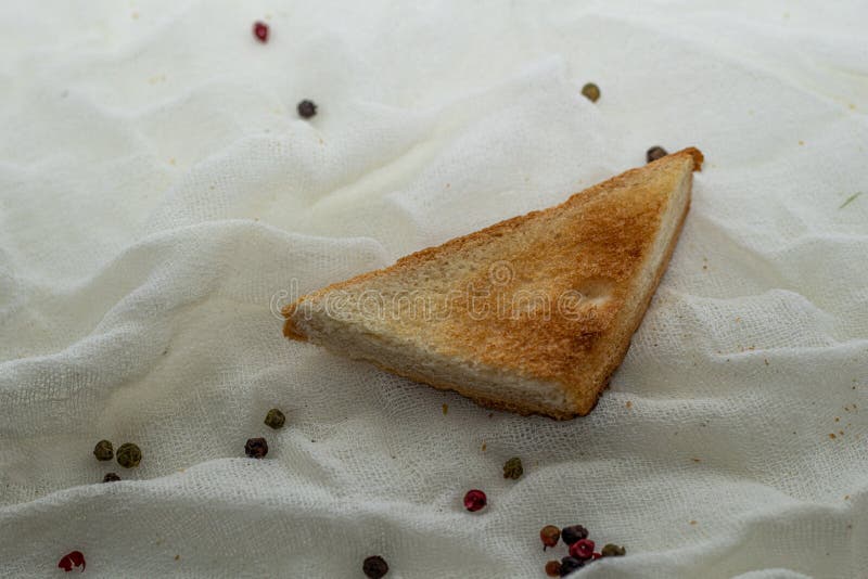 Fragrant Freshly Baked Bread in the Shape of a Triangle. a Slice on a ...