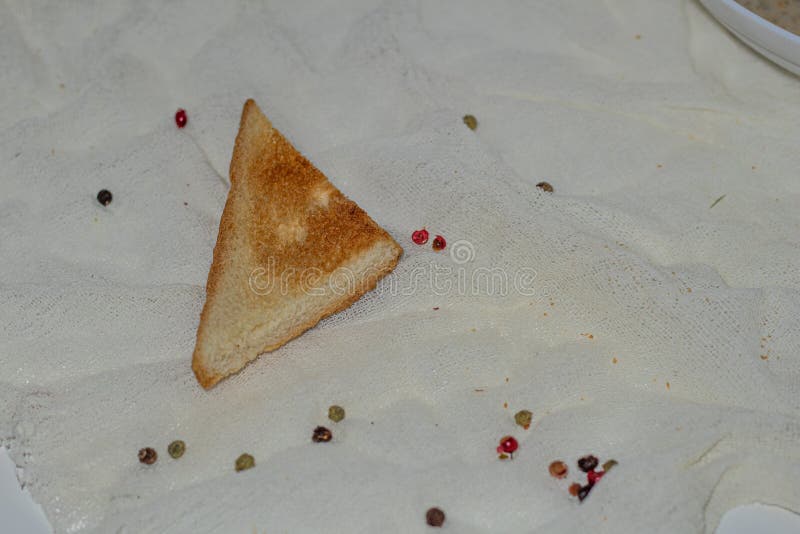 Fragrant Freshly Baked Bread in the Shape of a Triangle. a Slice on a ...