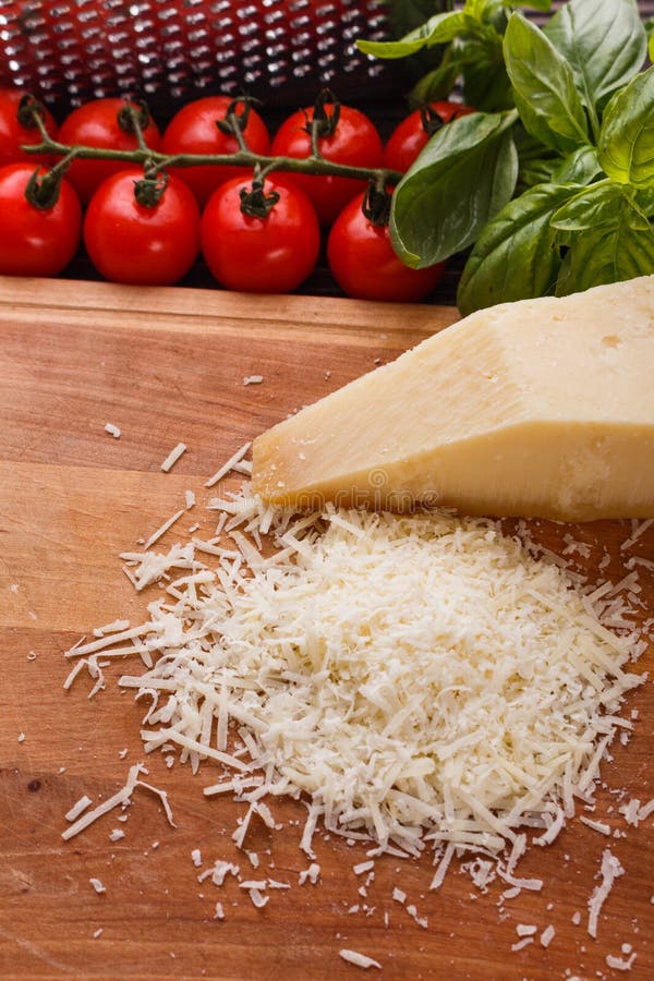 Fragrant Grated Parmesan on a Wooden Slicing Board Stock Image - Image ...