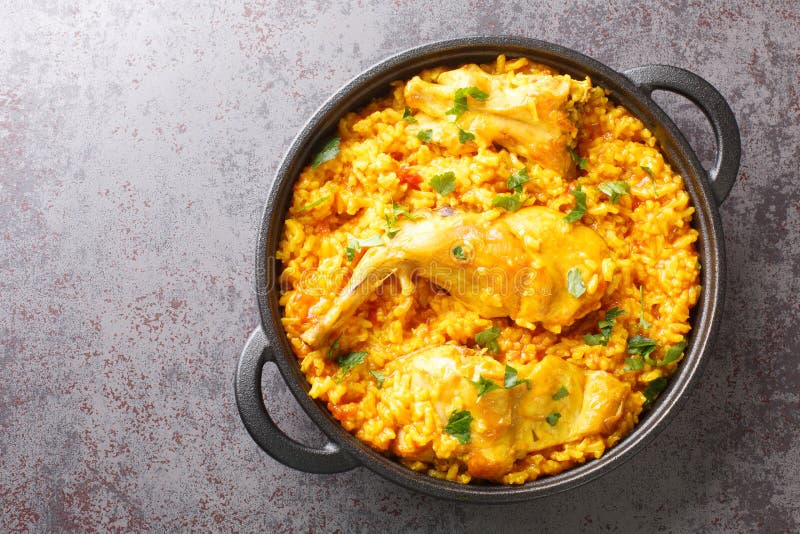 Fragrant Rice with Vegetables and Rabbit Meat Close-up in a Frying Pan ...