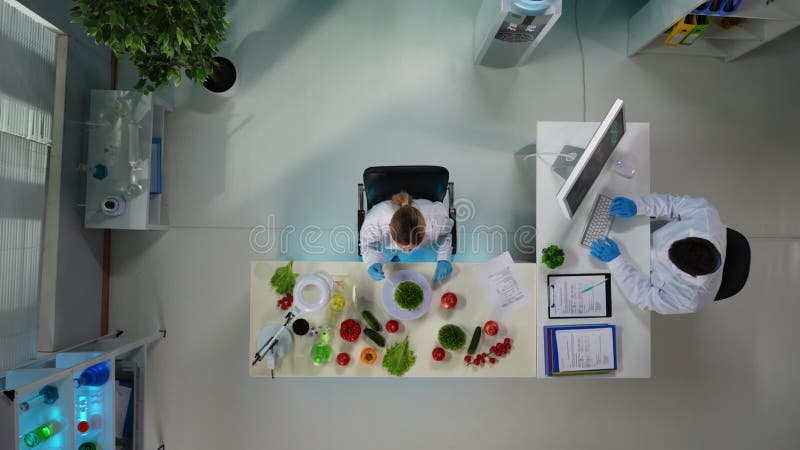 The Frame Above Shows Scientists Sitting in a Laboratory. a Woman is ...