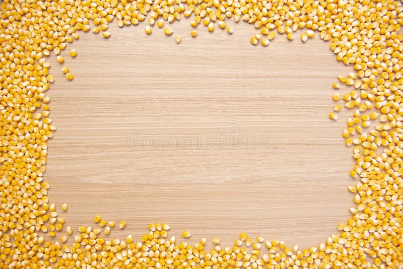 Frame Created by Grains of Raw Corn on Wood. White Space for Text ...