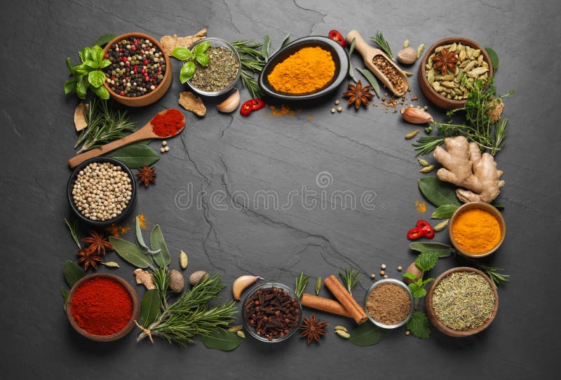 Frame of Different Herbs and Spices on Black Table, Flat Lay. Space for ...