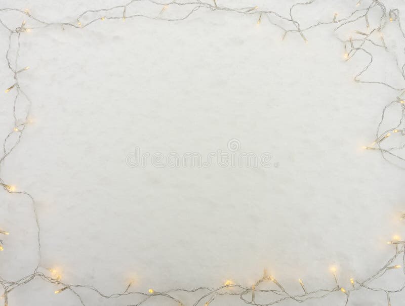 Frame of Garlands of Yellow Light on the Snow Stock Photo - Image of ...