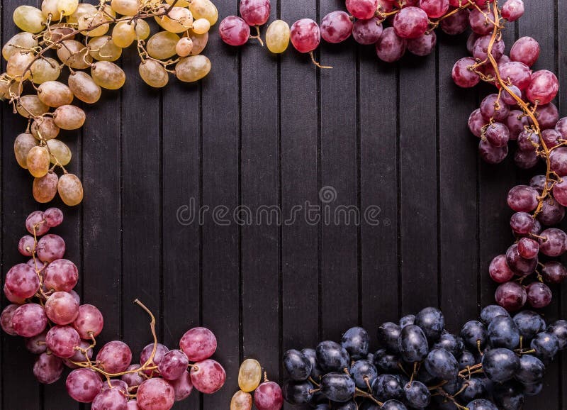 Frame from Grapes on Wooden Background Stock Image - Image of space ...