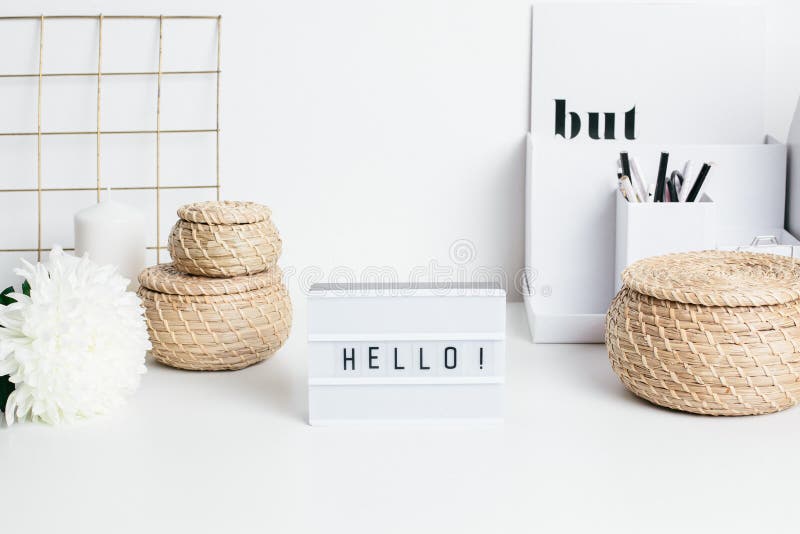Frame Hello on White Table with a Flower and Straw Baskets Stock Photo ...
