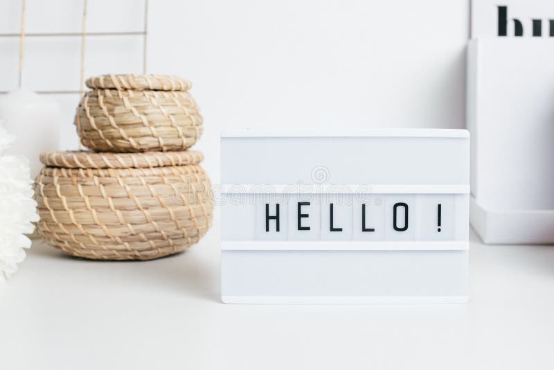 Frame Hello on White Table with Straw Baskets Stock Image - Image of ...