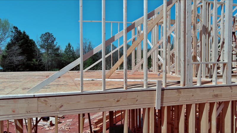 The Construction of a Stick House Involves Assembling Timber Beams into ...