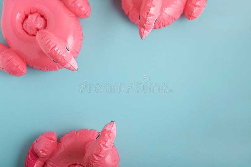 Frame from Inflatable Flamingo Pool Floats on Blue Background. Top View ...