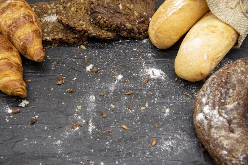 Frame Made of Different Bread and White Flour on a Dark Slate ...
