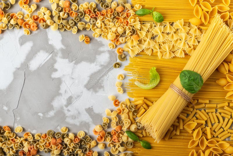 Frame Made of Different Paste with Greenery on a Concrete Background ...