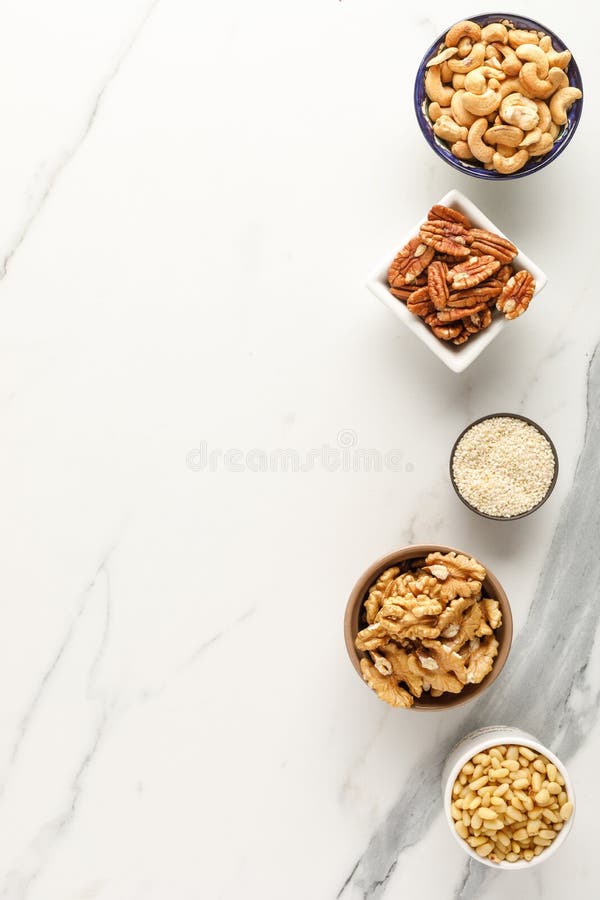 Frame Made of Different Types of Nuts in Bowls Stock Image - Image of ...