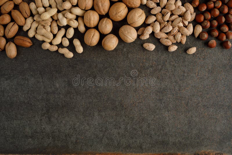 Frame Made of Different Types of Nuts on Stone Background Stock Photo ...