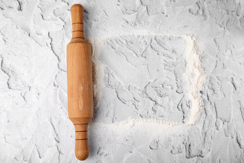 Frame Made of Flour and Rolling Pin on White Textured Table, Top View ...