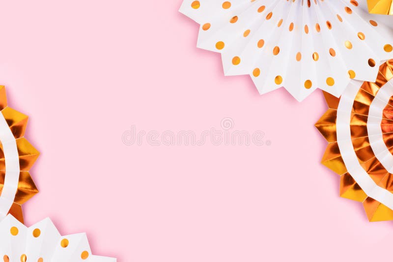 Frame Made of Golden Paper Fans on a Pink Background. Stock Photo ...