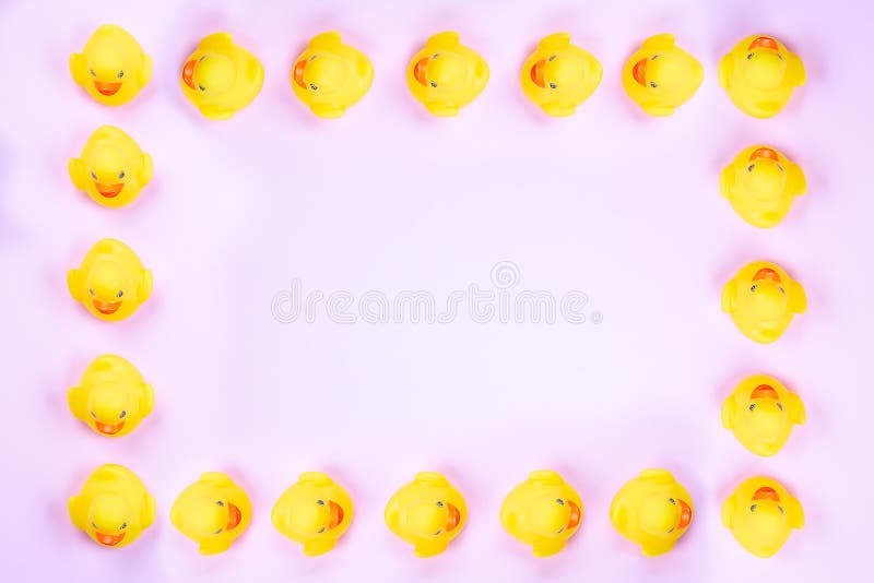 Frame Made from Group of Rubber Ducks on Pink Background, Place for ...