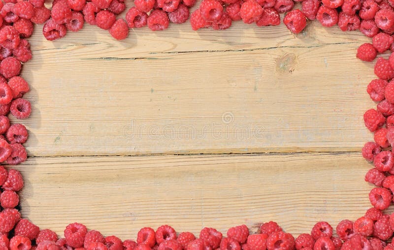 Frame made of raspberries. stock image. Image of board - 20280393