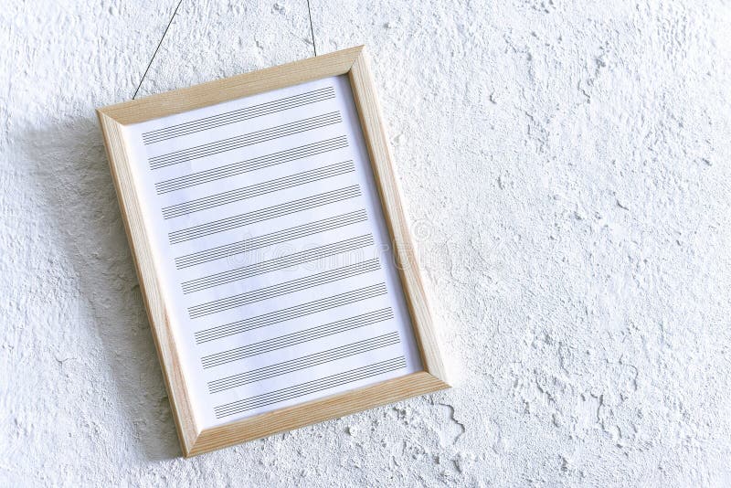 Frame with Notes Hanging on a White Wall Stock Photo - Image of melody ...