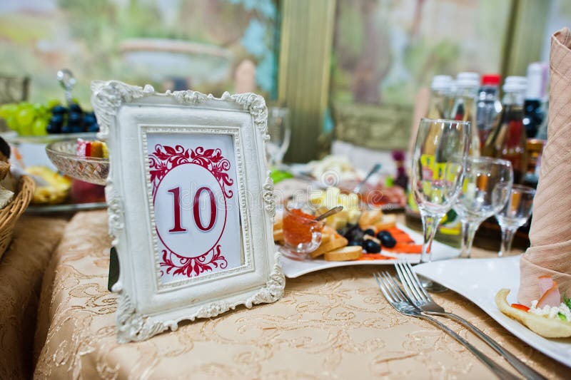 Frame with Number Ten at Table of Guest on Wedding Restaurant. Stock ...