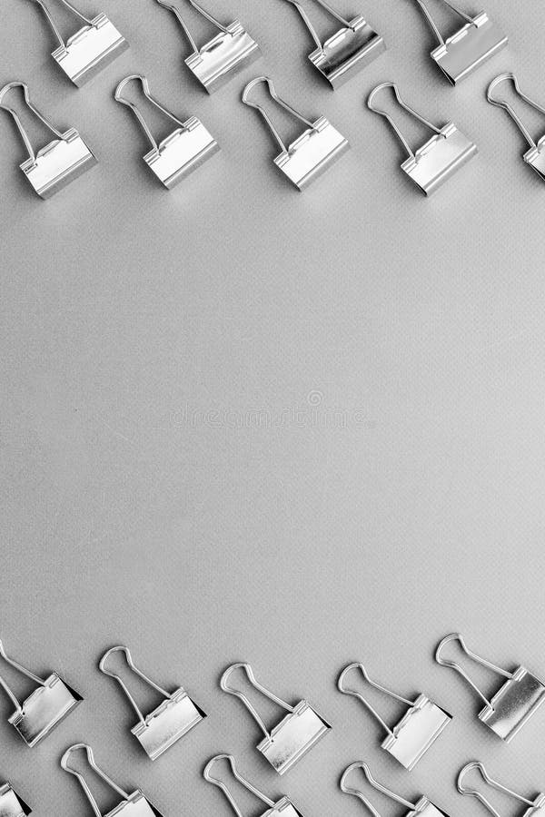 Frame of Silver Paper Binder Clips Top View. Office Supplies Pattern ...