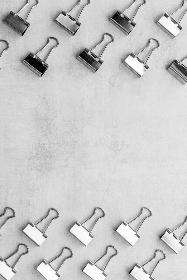 Frame of Silver Paper Binder Clips Top View. Office Supplies Pattern ...