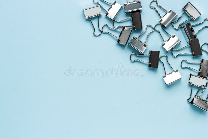 Frame of Silver Paper Binder Clips Top View. Office Supplies Pattern ...