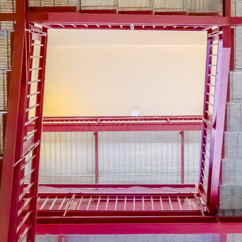 Frame Square Stairs with Grated Treads and Bright Red Handrails Viewed ...