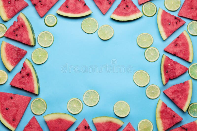 Frame of Tasty Sliced Watermelon and Limes on Light Blue Background ...