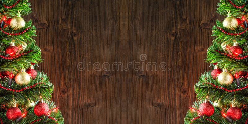 Frame of Two Christmas Trees Over Wooden Wall Background Stock Image ...