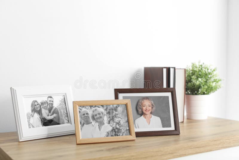 Framed Photos on Cabinet Near Wall Stock Image - Image of concept ...