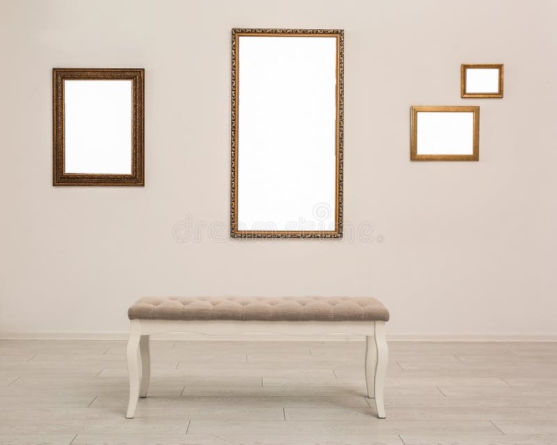 Frames with Empty Canvases on Wall and Bench in Modern Art Gallery ...