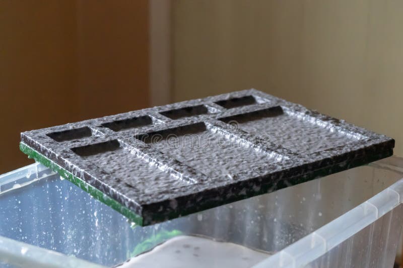 Frames with Pulp for Making Hand-made Paper Lie on a White Dish on the ...