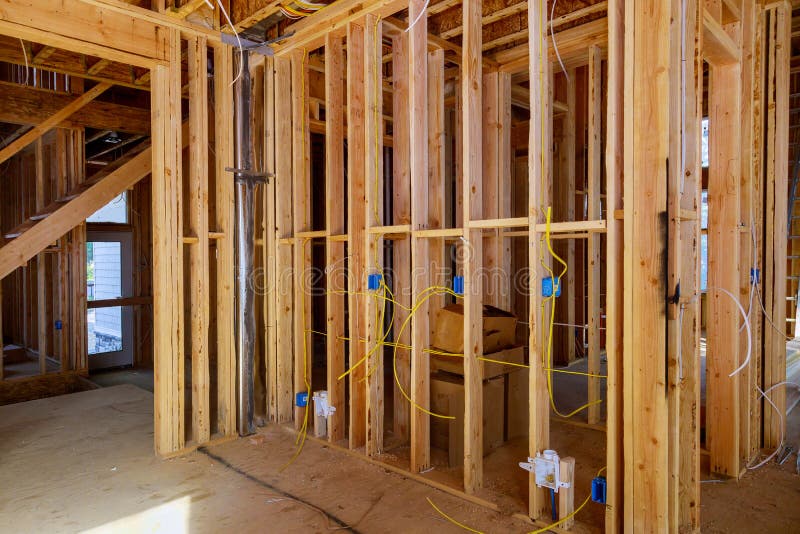 New Home Construction Framing of a House Under Construction Stock Image ...