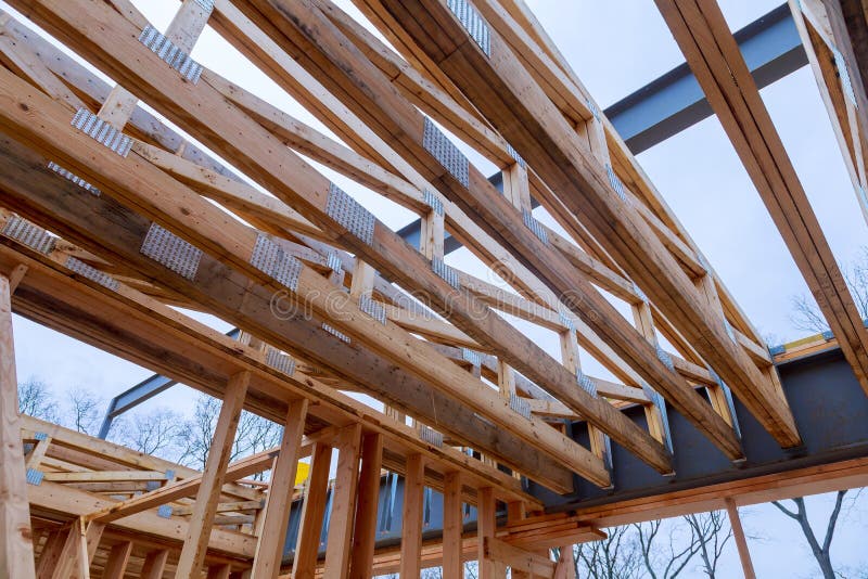 New Home Construction Framing of a House Under Construction Stock Photo ...
